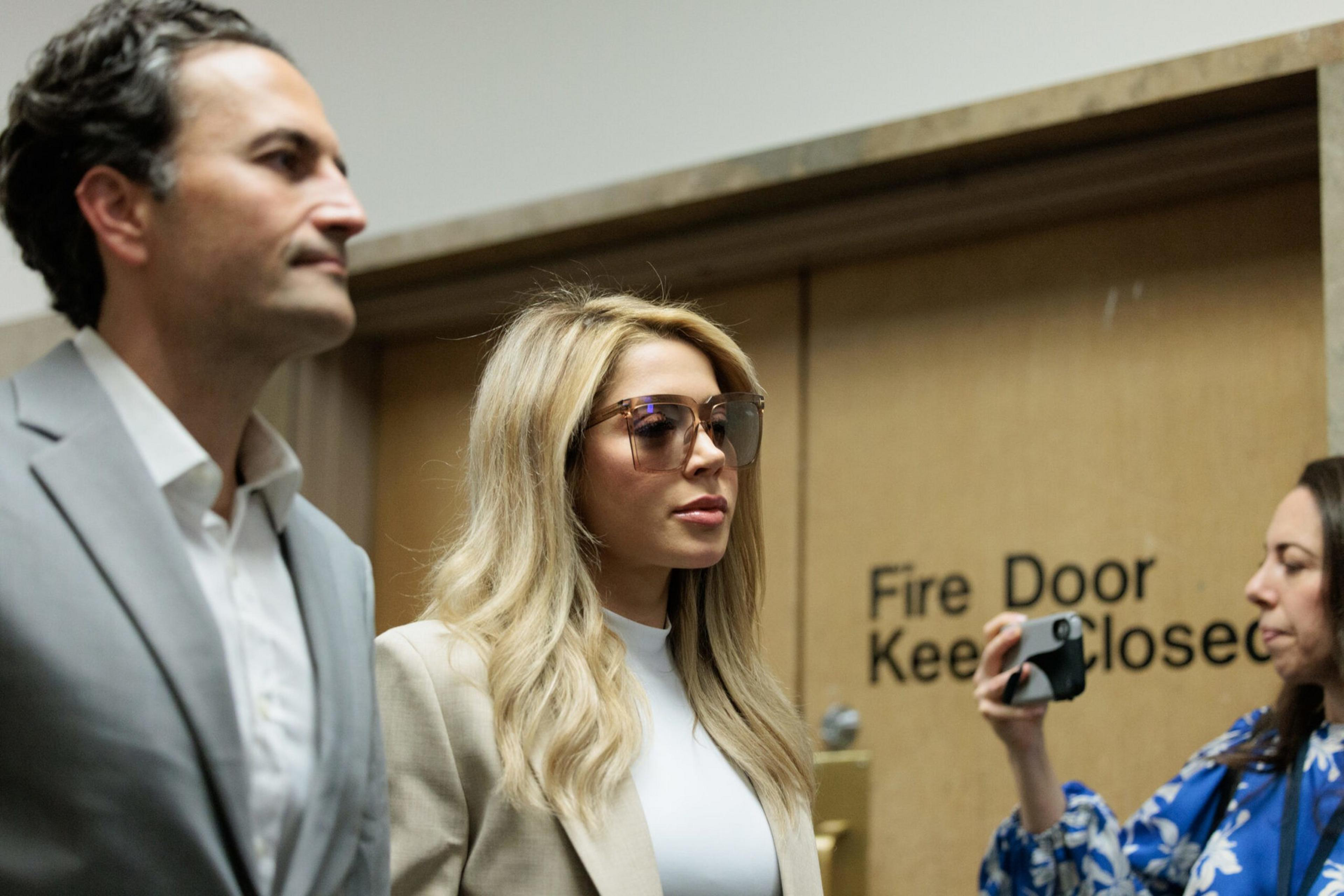 Khazar Momeni, alongside husband Dr. Dino Elyassnia, was at the center ...