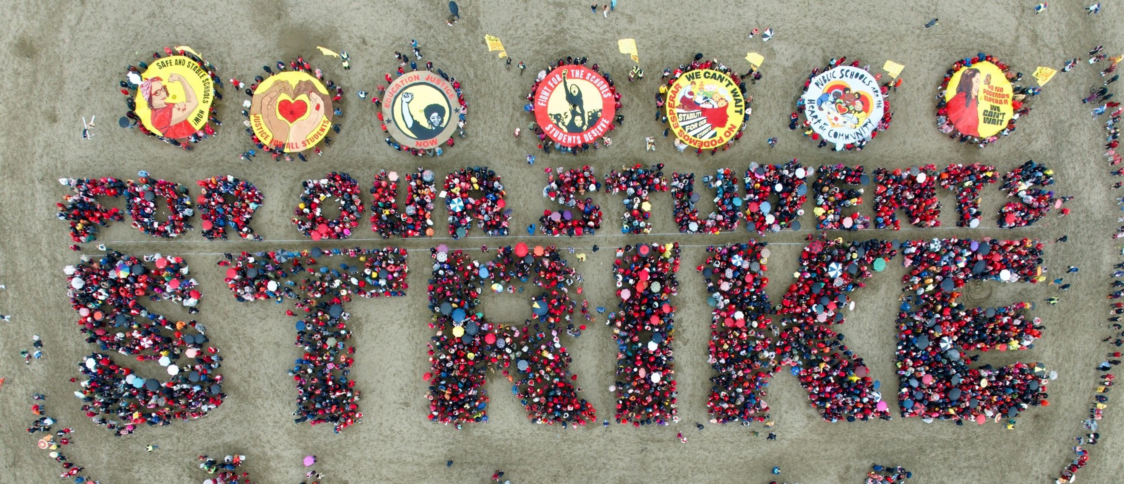 Thousands of people form the words “FOR OUR STUDENTS STRIKE” on the ...